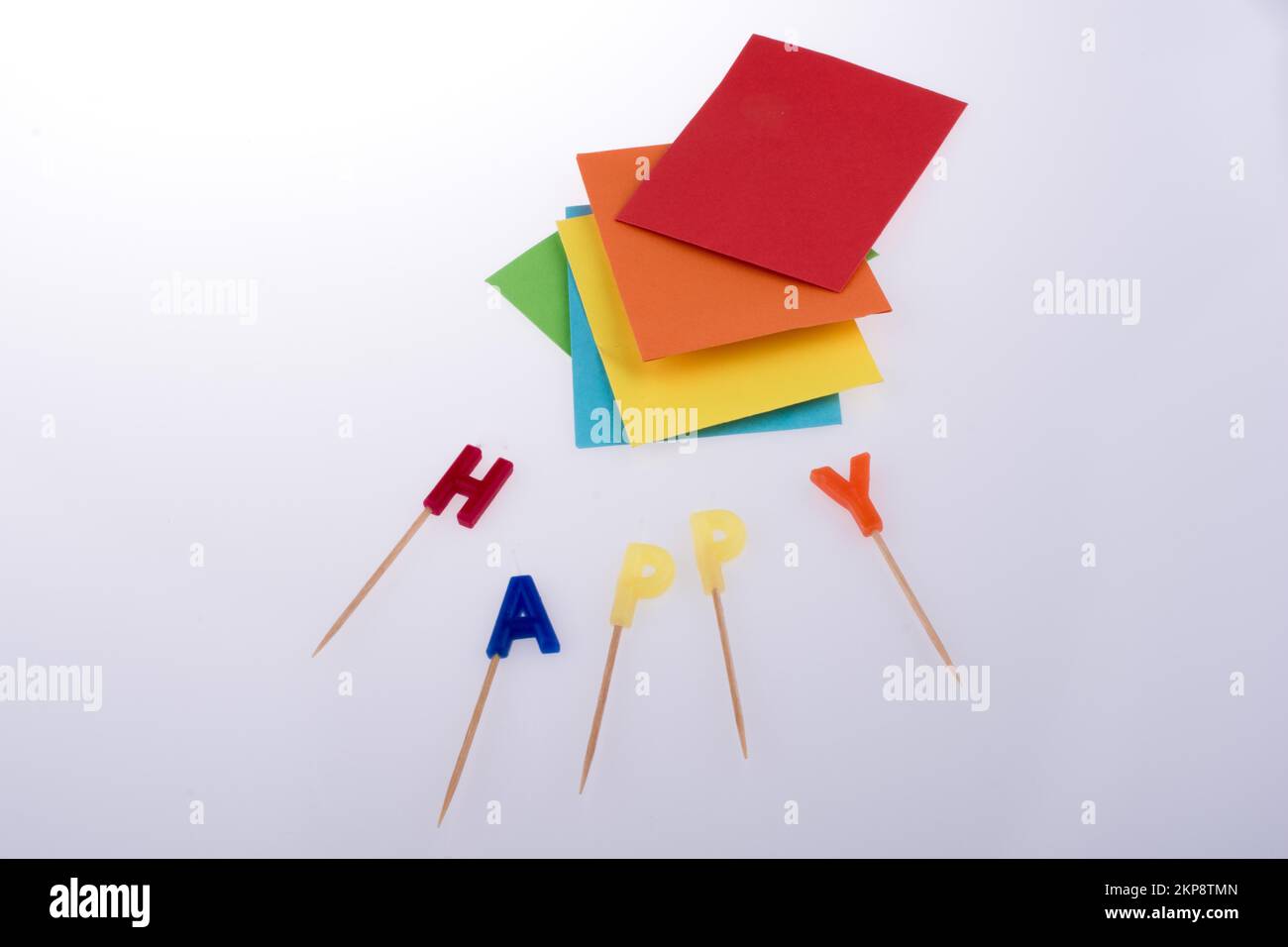 Colored envelopes and Color candles on sticks write happy Stock Photo ...