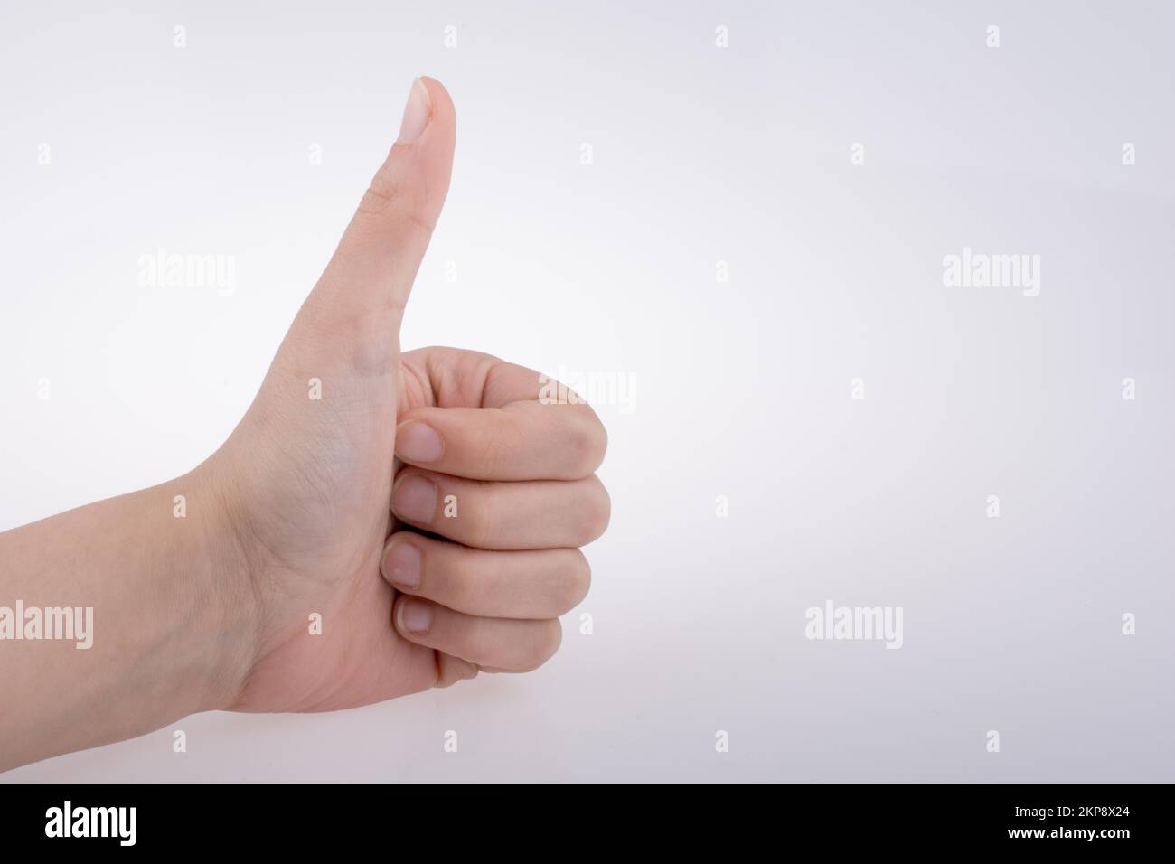 Hand making a good gesture on a white background Stock Photo - Alamy