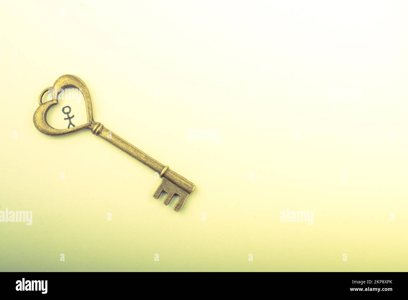 Tiny stick man and heart shaped key on white Stock Photo - Alamy