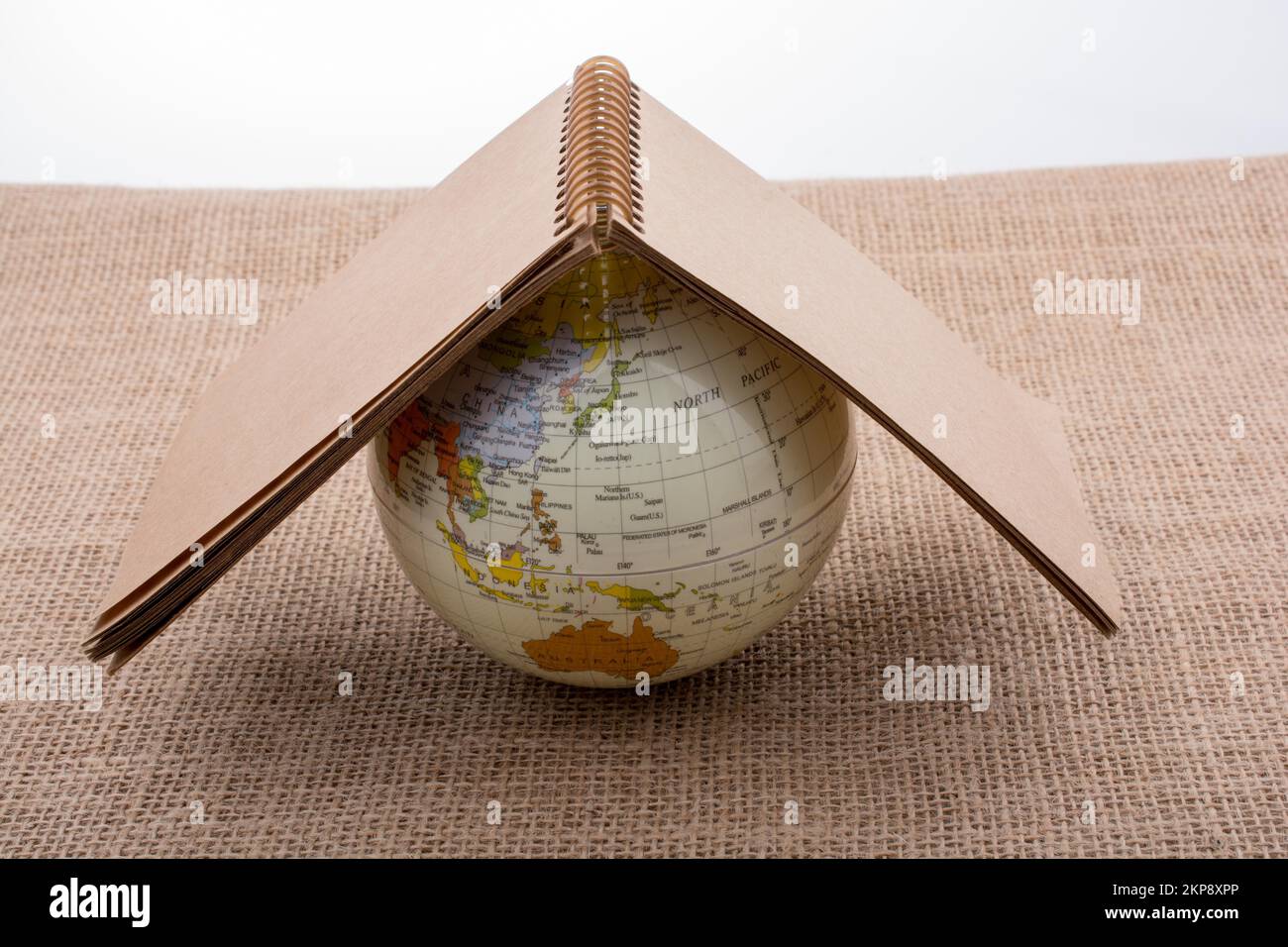Globe is placed on canvas background Stock Photo - Alamy