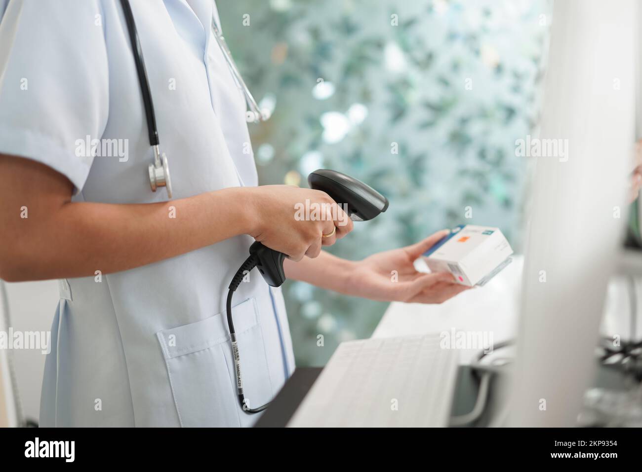 Medicine and health concept, Female pharmacist scanning medicine ...