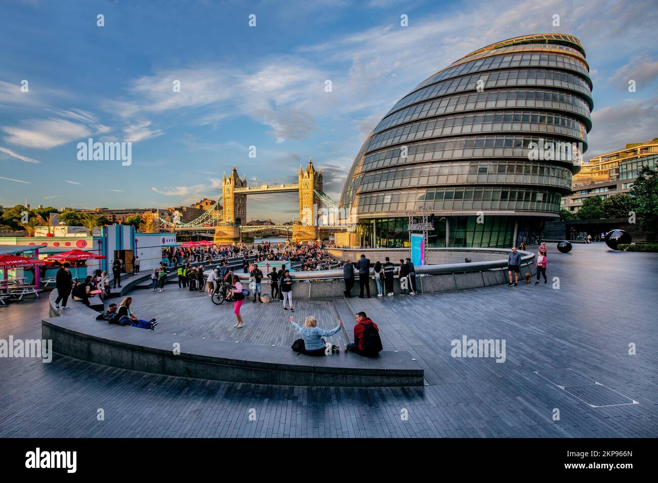 Spectators at The Scoop amphitheatre with London City Hall and Tower ...