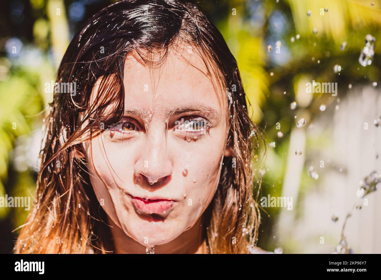 Woman enjoying outdoor shower hi-res stock photography and images - Alamy
