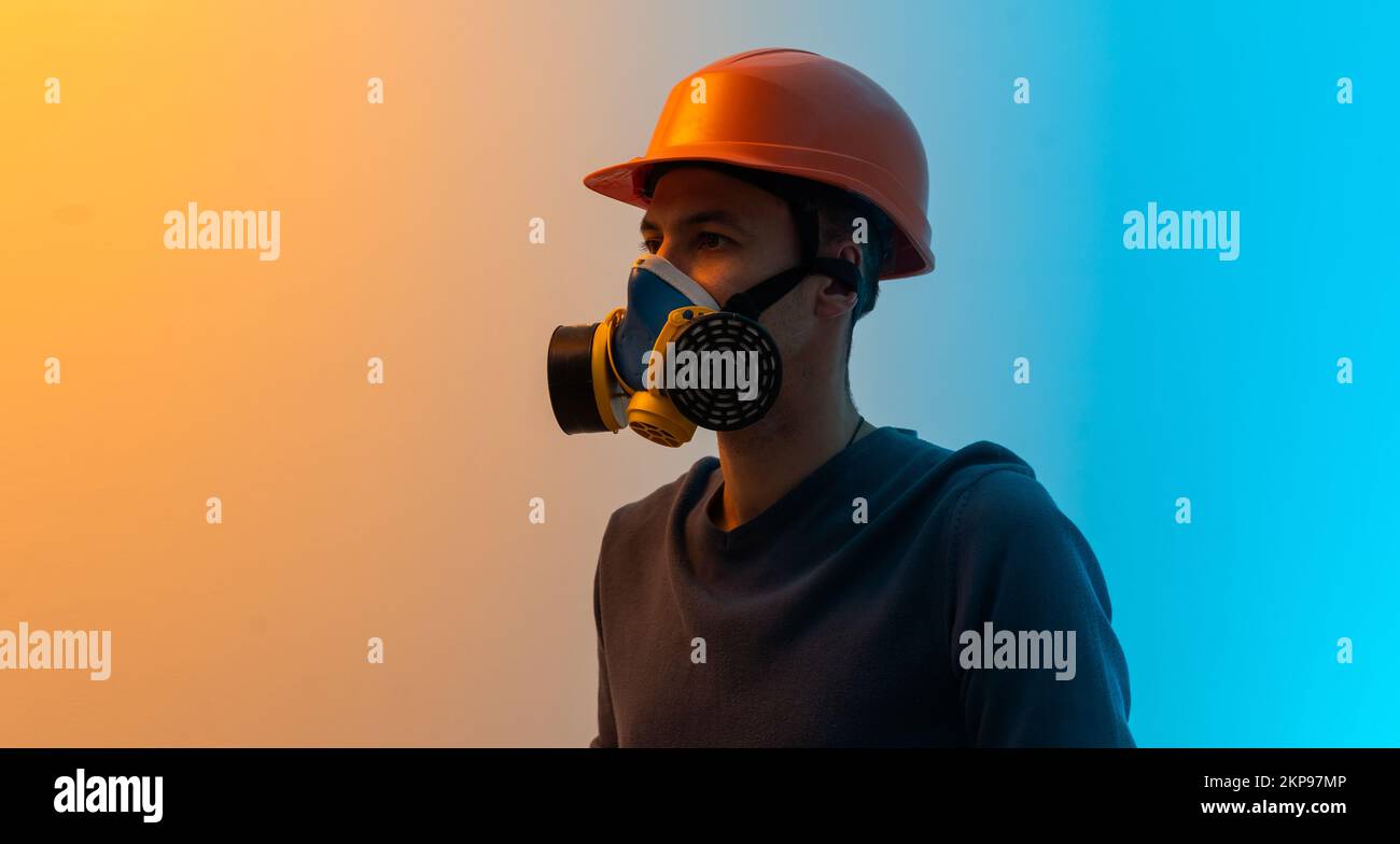 a man in a mask with a filter and a helmet color background Stock Photo ...