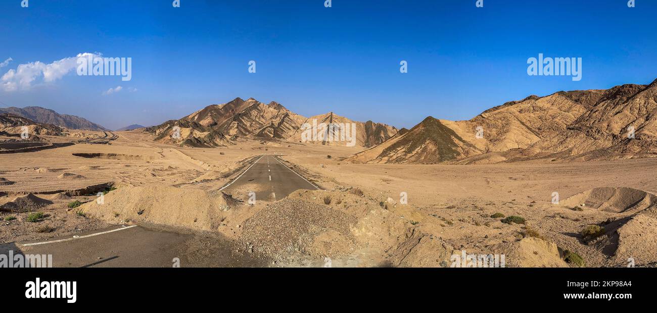 Old blocked road, desert sand and mountain ridge, Dahab, Sinai, Egypt ...