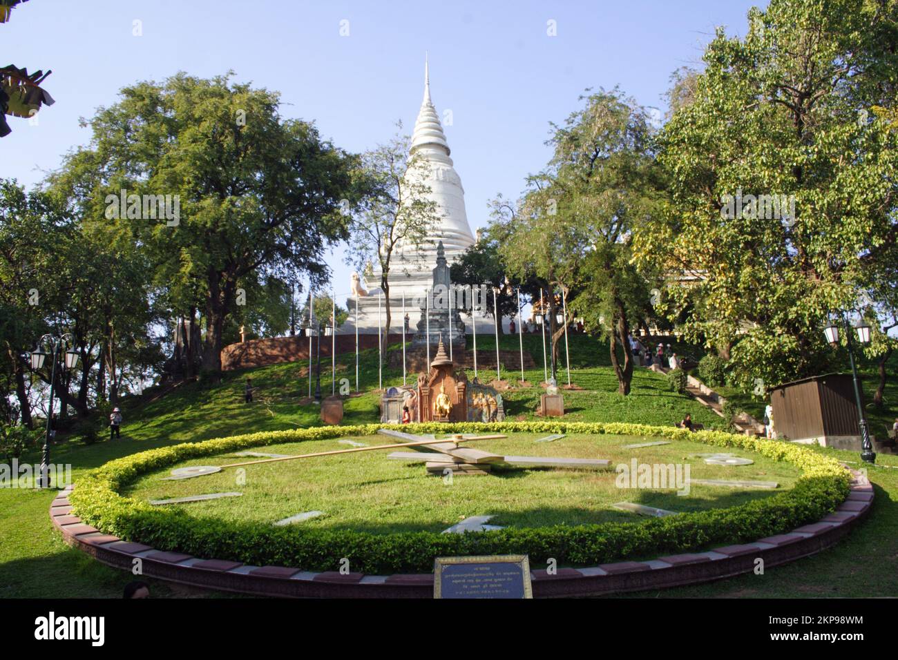Stupa, Buddha statue and clock, Wat Phnom. Phnom Penh, Cambodia Stock ...