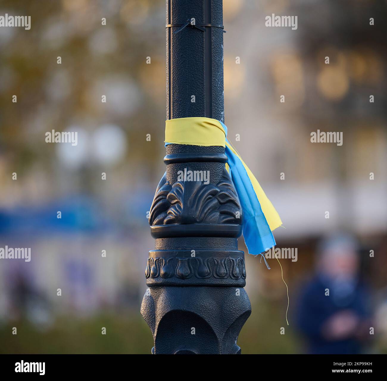 Blue and yellow silk ribbon tied on a metal tube. Ukrainian flag symbol ...