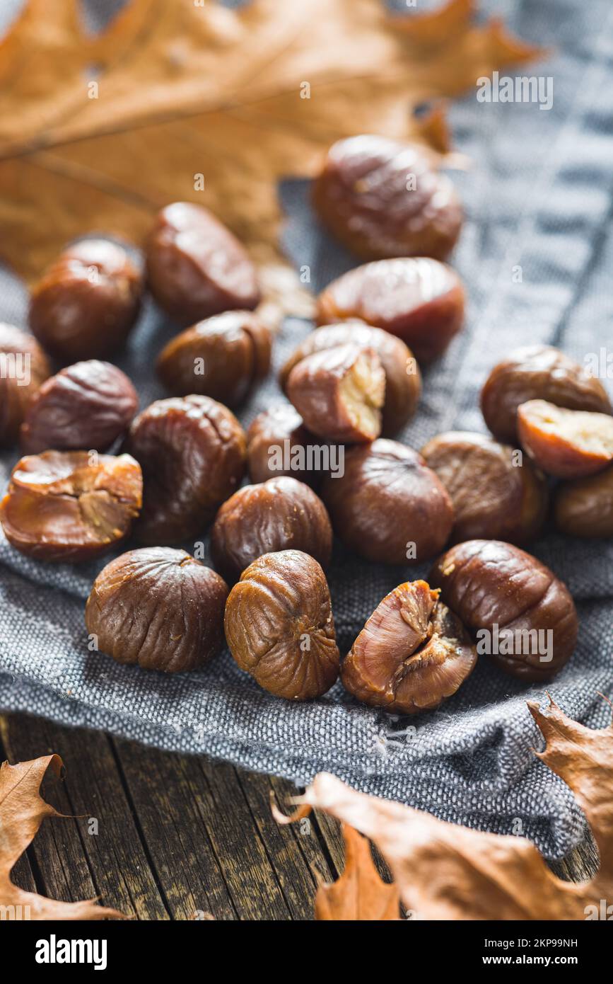 Peeled chestnuts. Sweet roasted chestnuts on the cutting board Stock ...