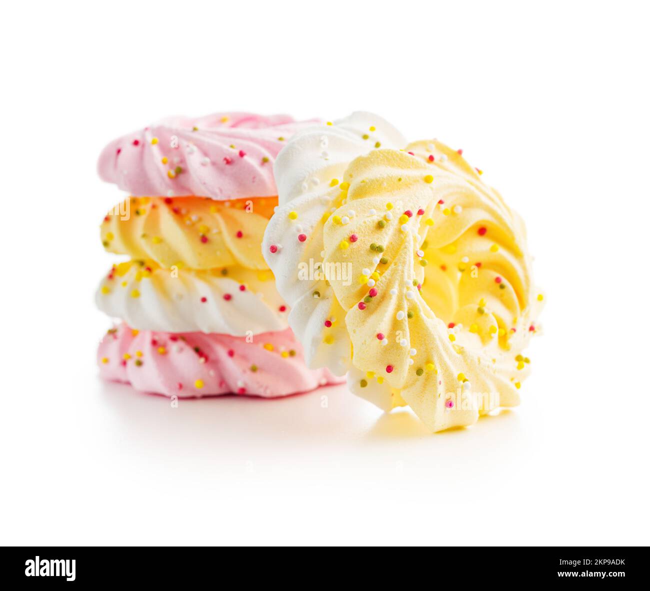 Different colors meringues with sprinkles isolated on the white ...