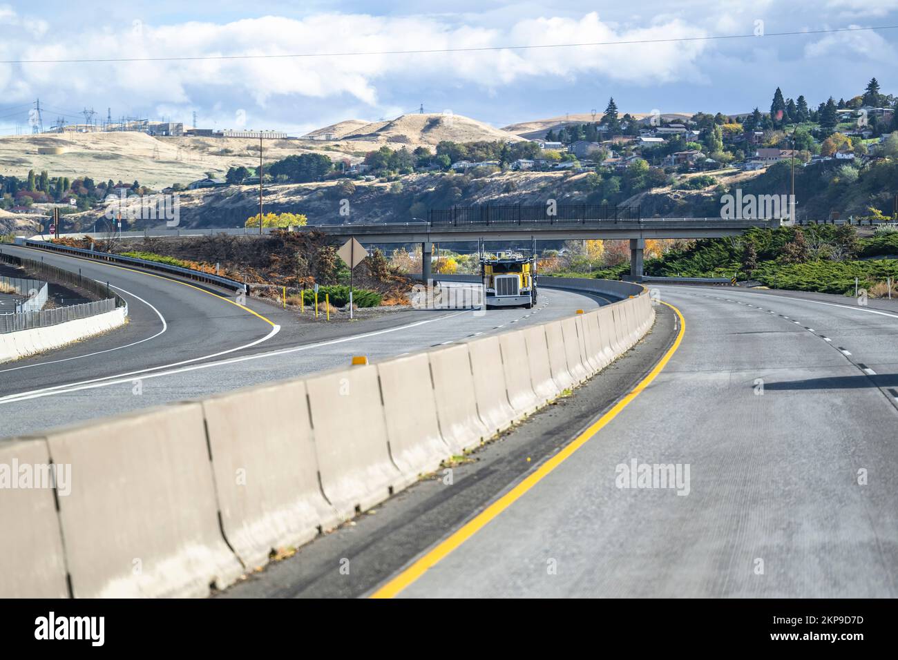 Yellow classic big rig car hauler semi truck with empty two level ...