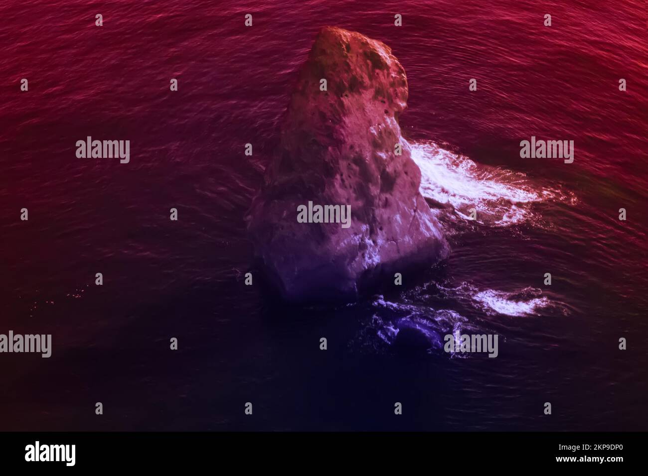 Damn finger, finger-stone coastal vertical rock. Fantasy in blue-red ...