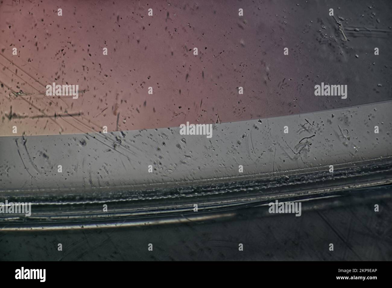 The surface of a old plastic DVD disc. Extreme close up computer ...