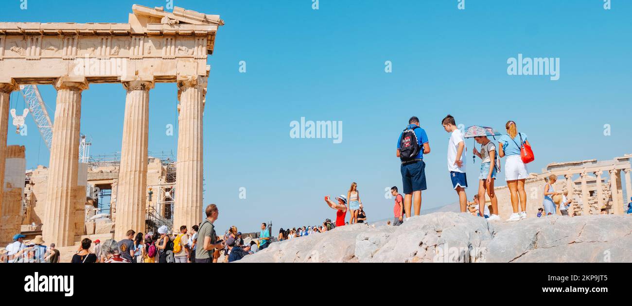 Athens, Greece - August 30, 2022: A crowd of tourists visit the Acropolis of Athens, in Greece ...