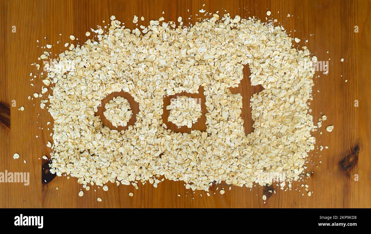 Oat flakes on wooden table. Top view. Healthy food and lifestyle ...