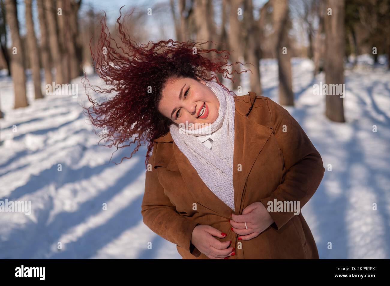 Fat caucasian woman dancing on a walk in the park in winter Stock Photo ...