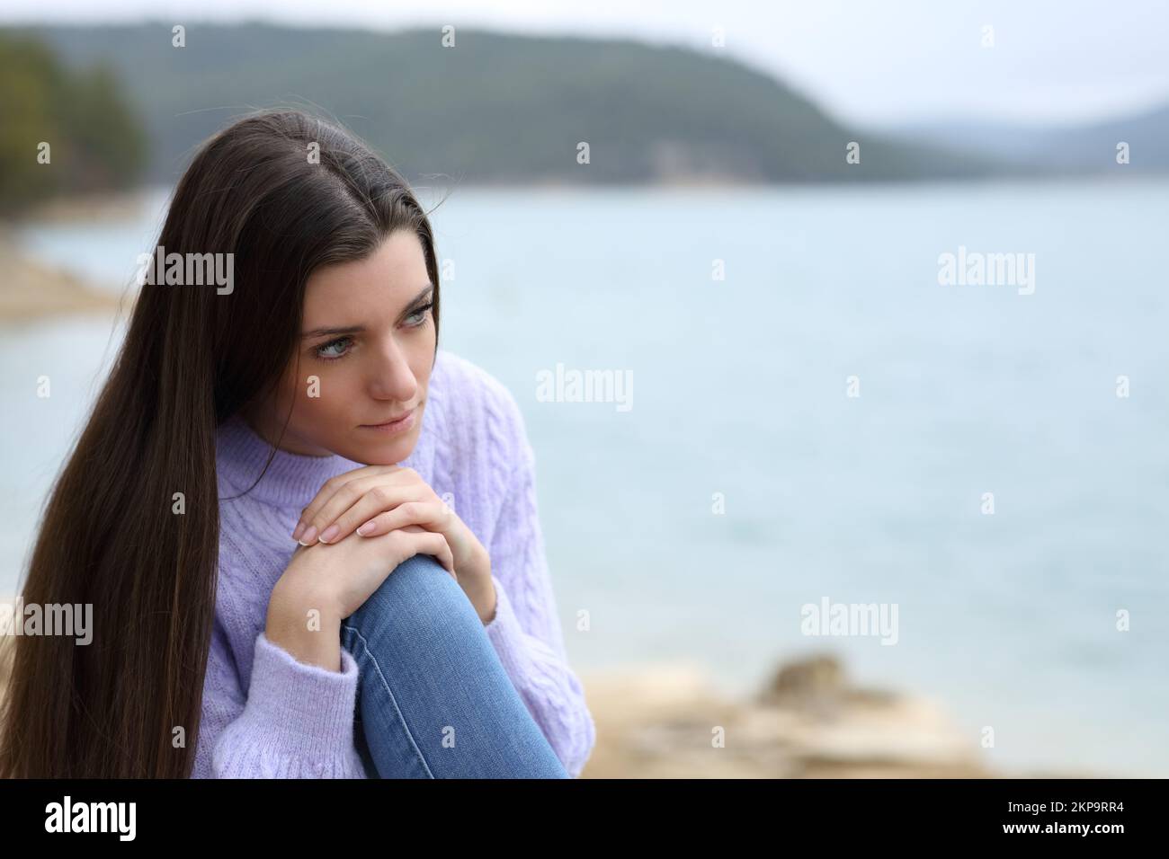 Serious woman thinking contemplating in nature Stock Photo - Alamy