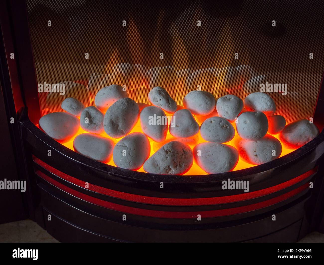 Close up of a lit coal effect electric fire in a UK house. Concept for ...