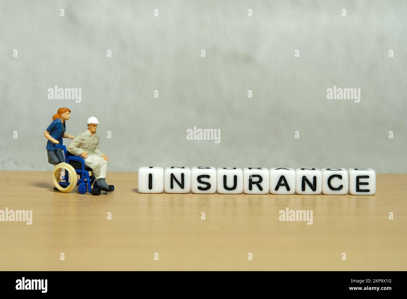 Miniature people toy figure photography. Worker health insurance ...