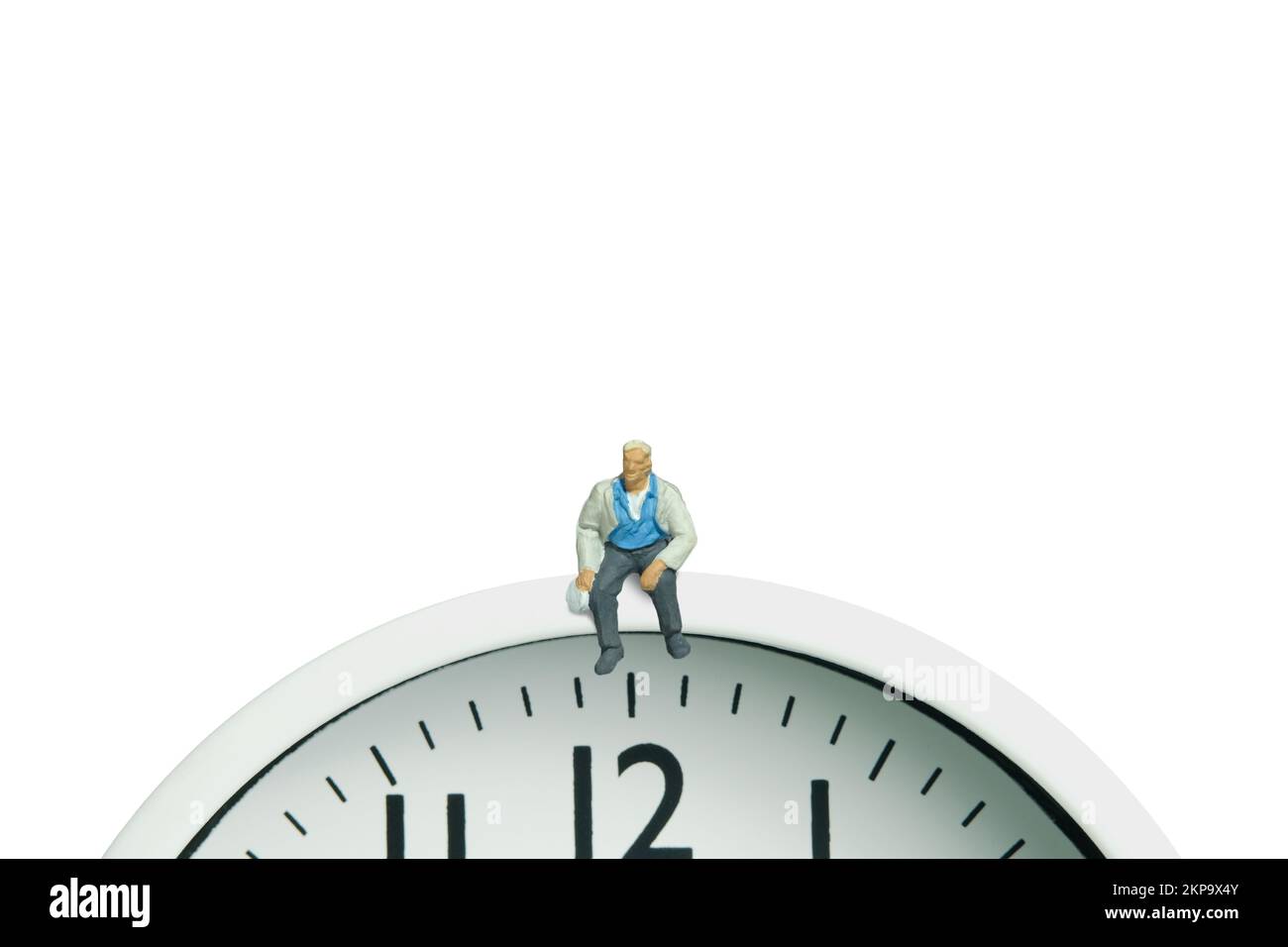 Miniature people toy figure photography. A men worker take a break rest ...