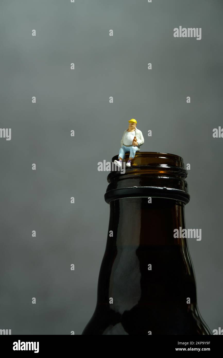 Miniature people toy figure photography. Stressed and depressed fat men ...
