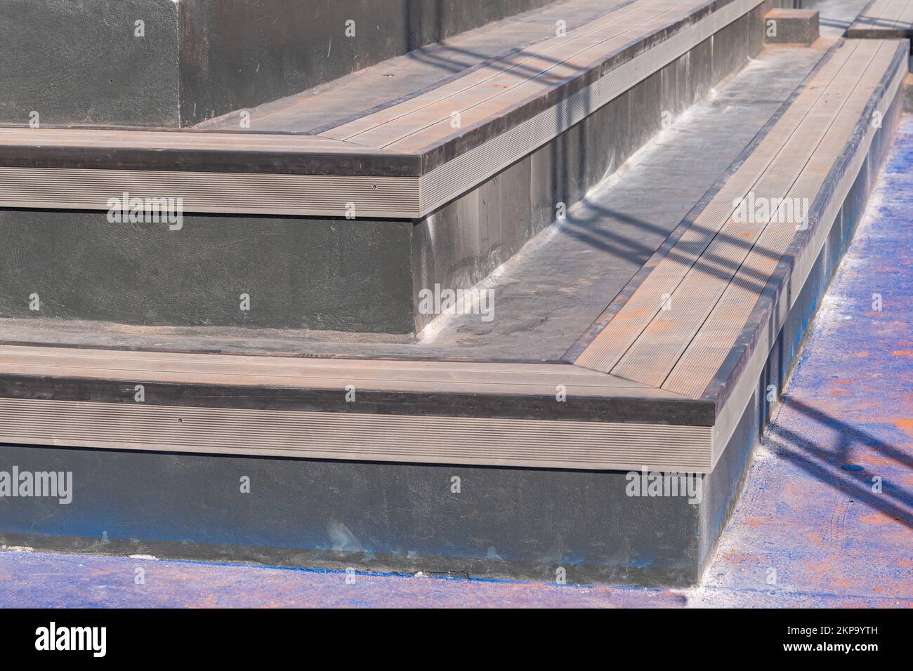 Seating area for spectators made with composite deck next to the tennis ...