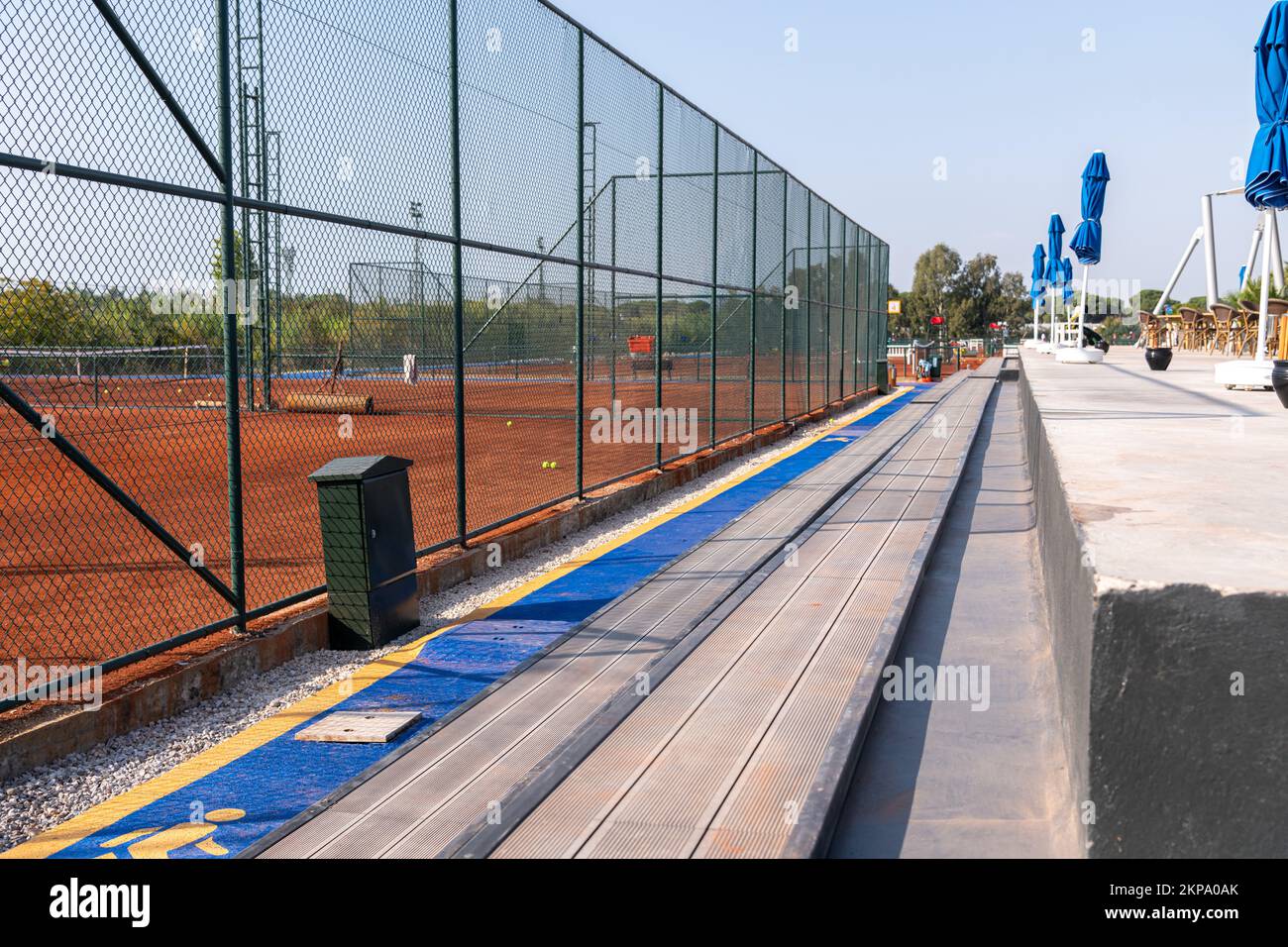 Seating area for spectators made with composite deck next to the tennis ...