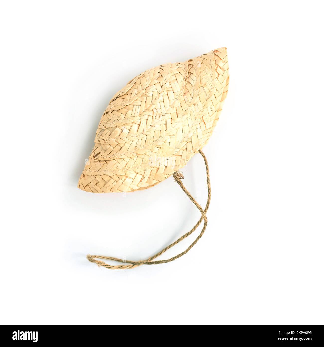 Small wicker straw hat on white background Stock Photo - Alamy