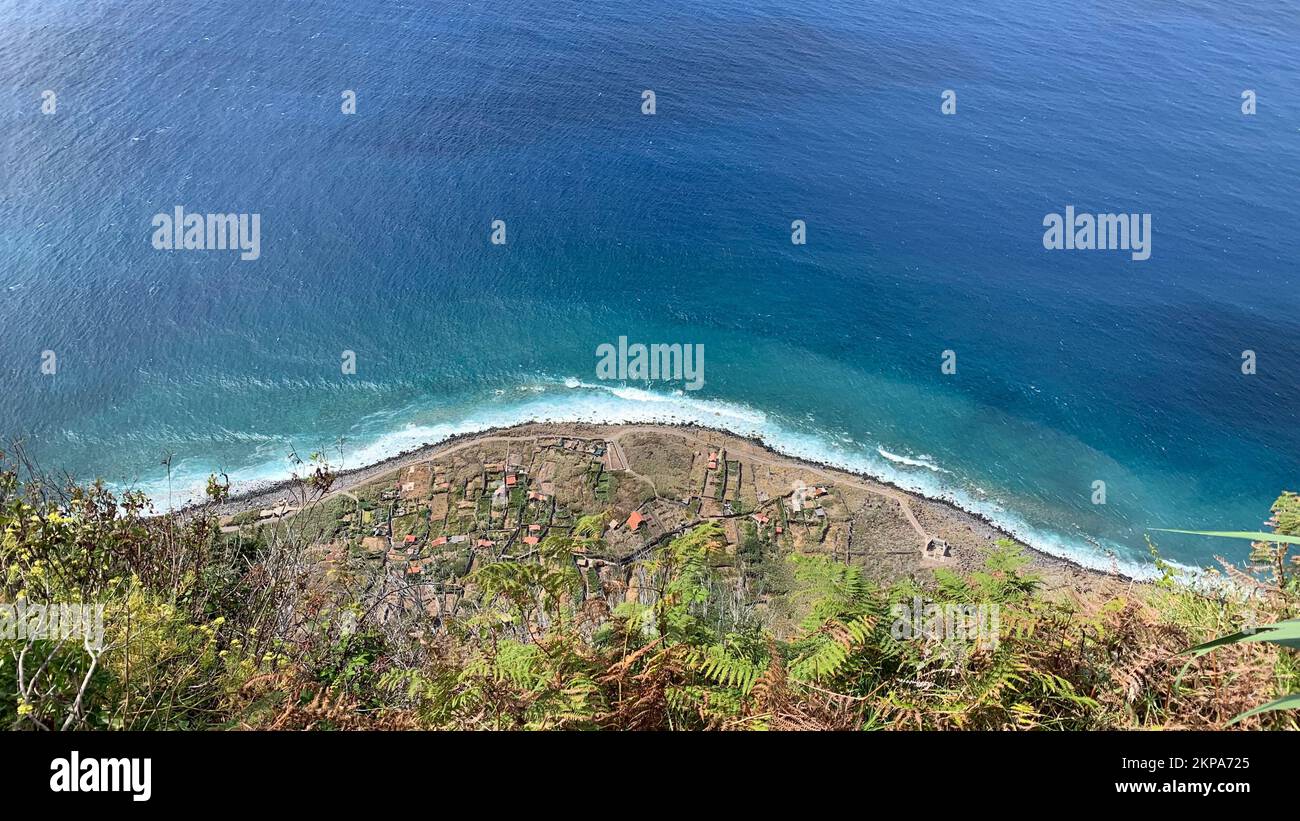 An aerial view of a seascape with the small fishing village of Canical ...