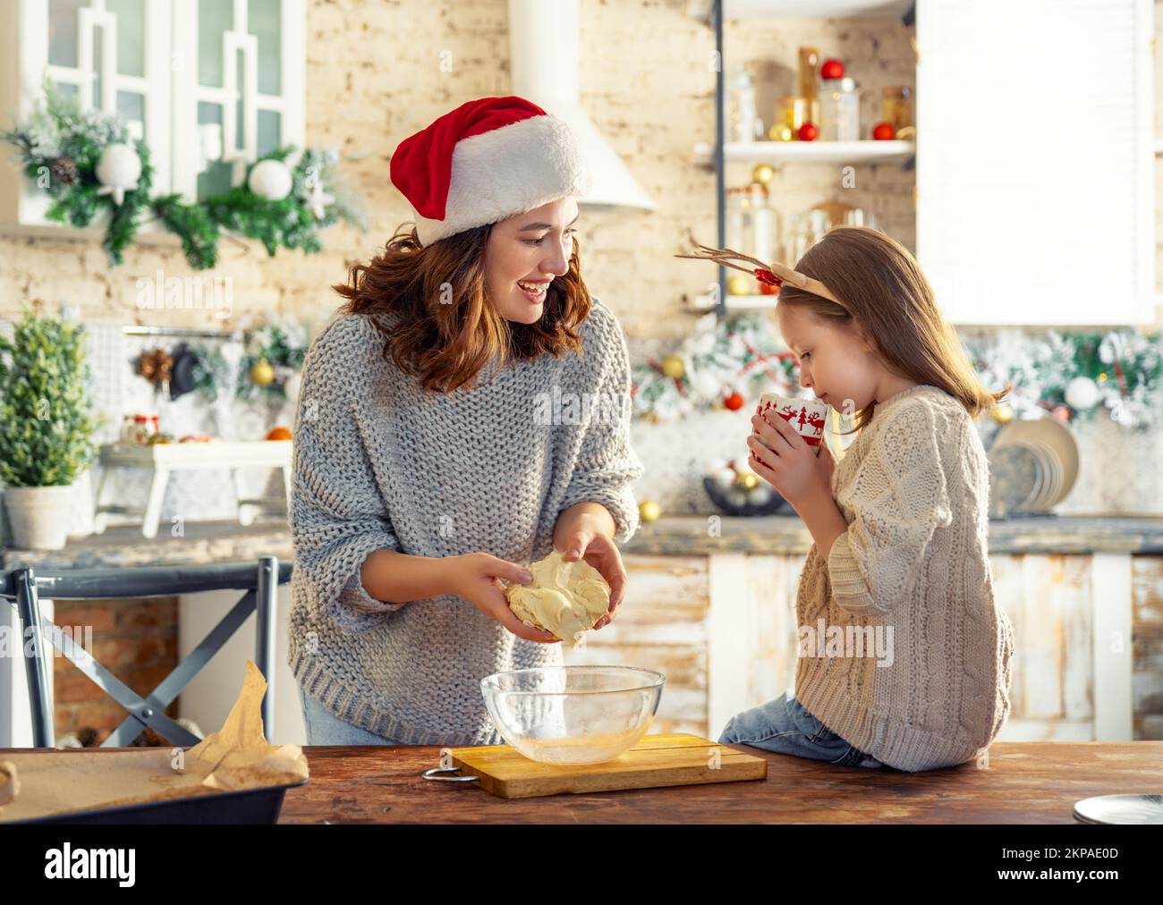 Merry Christmas and Happy Holidays. Family preparation holiday food ...