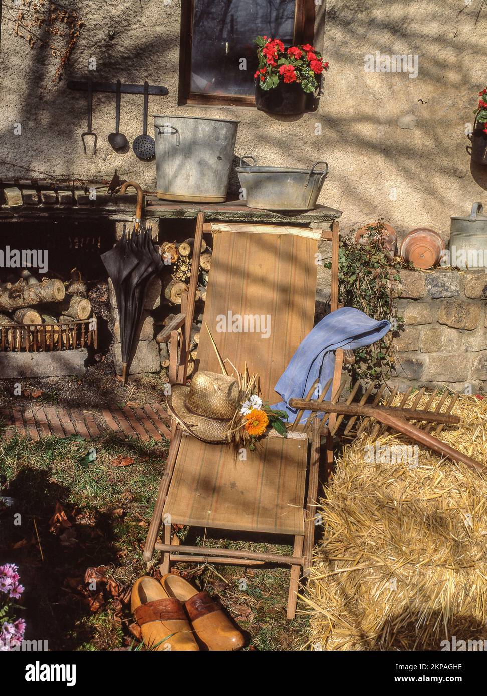 A vertical shot of the chair and vintage kitchen staff in the rustic ...