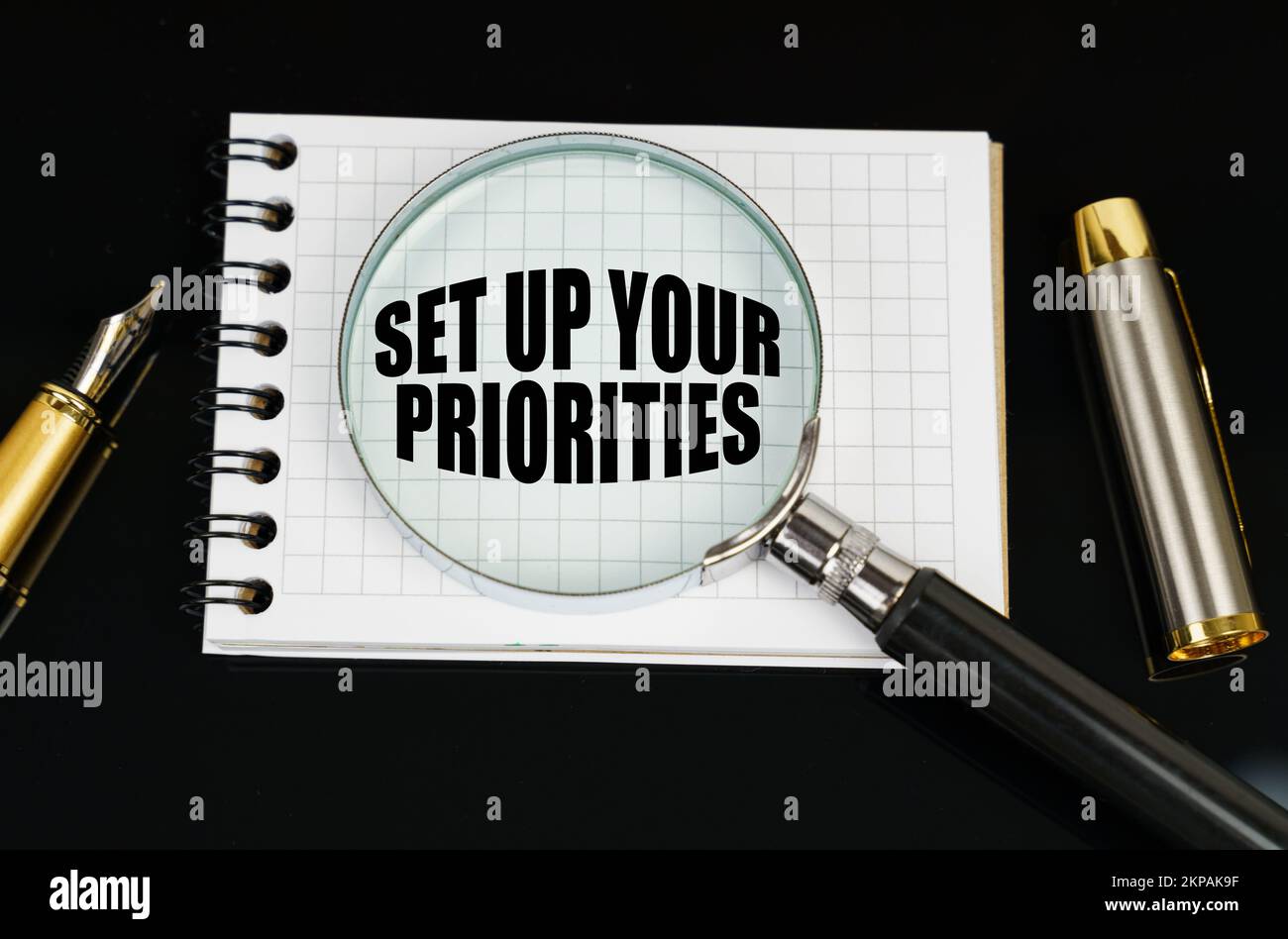 Business and finance concept. On a black surface there is a pen, a ...