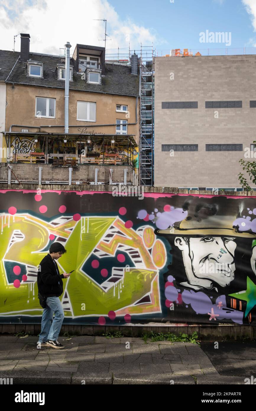 graffiti on a building fence on Steinweg in the historic town, Cologne ...