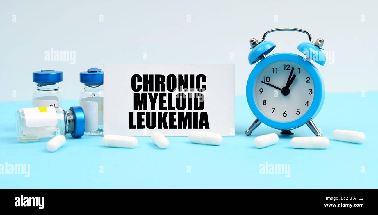 Medicine and health concept. An alarm clock, pills, injections and a ...