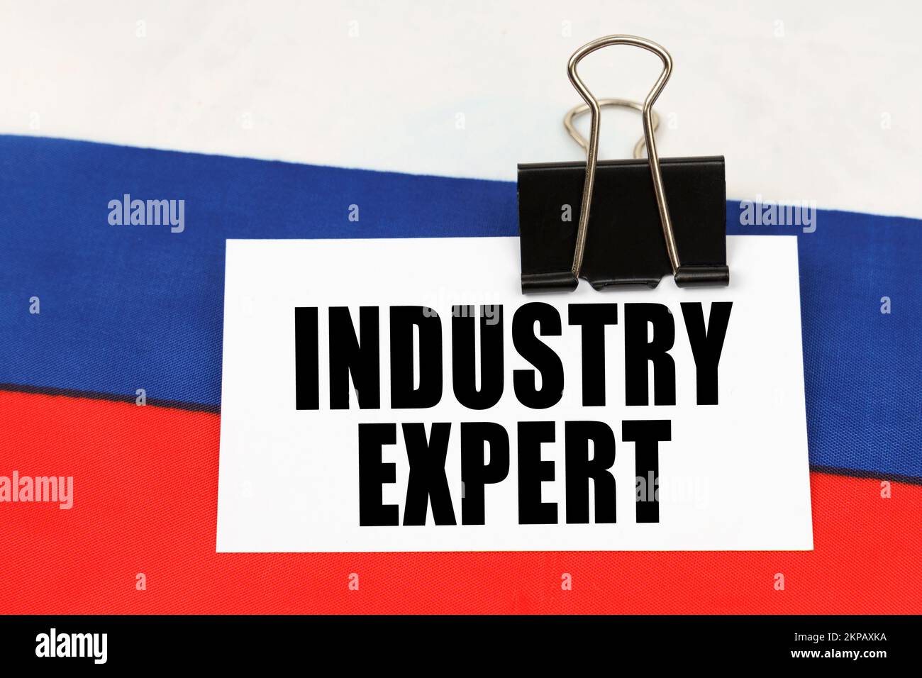 National concept. On the flag of Russia there is a business card with ...