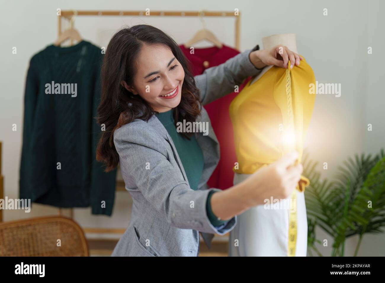 Asian Woman fashion designer cloth tailor creative working for new ...