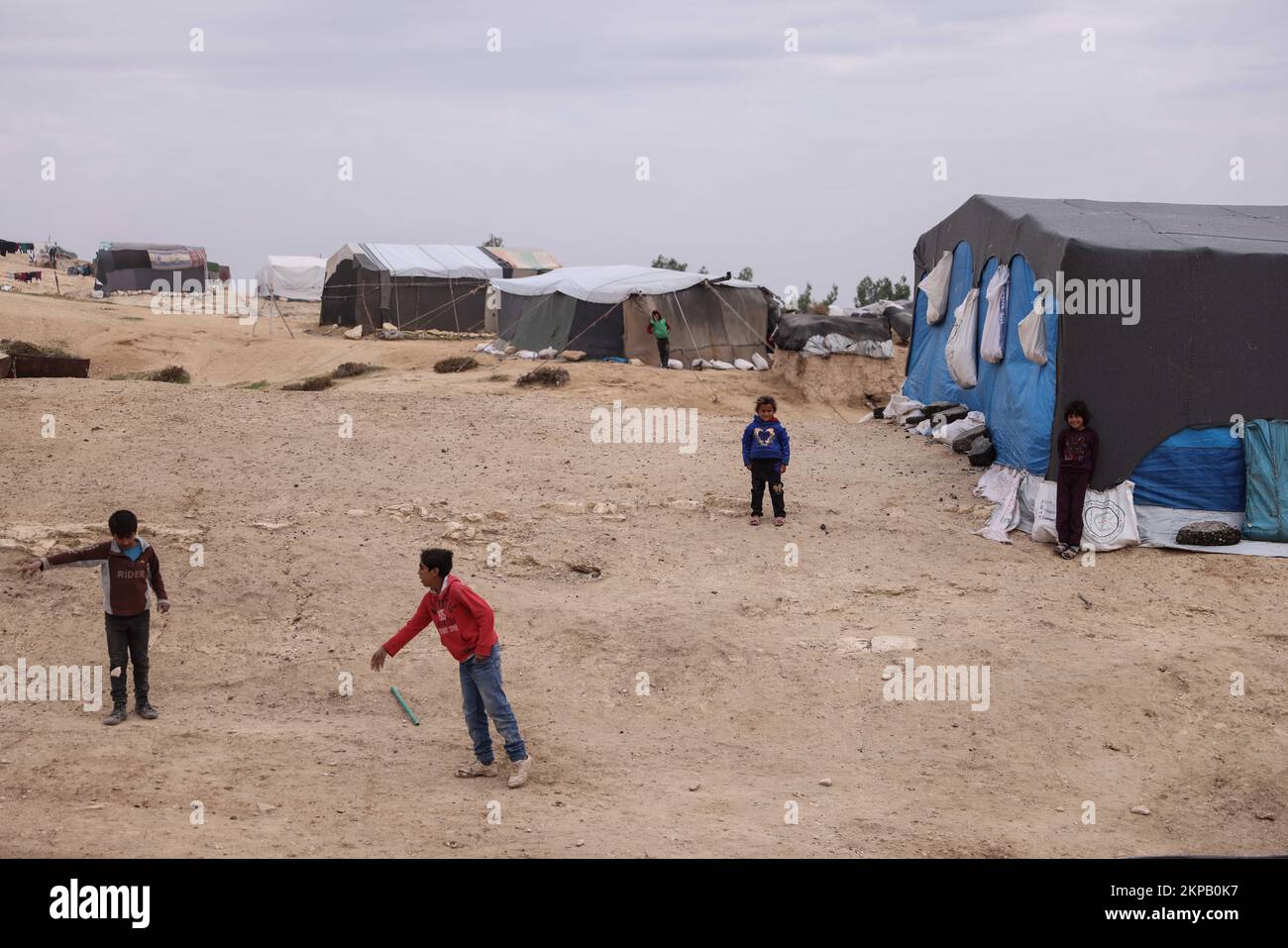 28 November 2022, Syria, Azaz: Syrian children play at Bersaya refugee ...