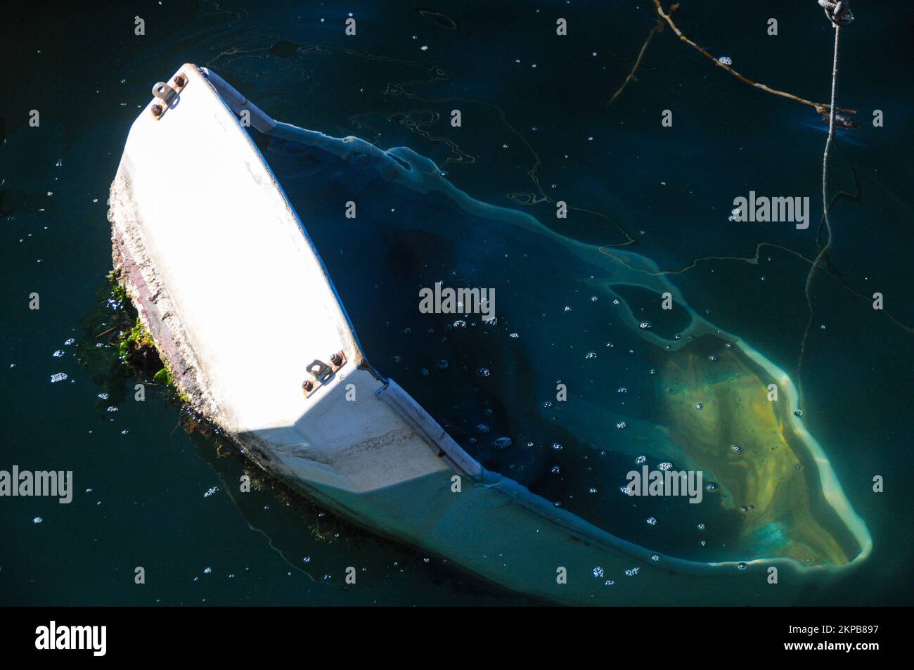 Small boat in San Diego Harbour. Its Sinking Stock Photo - Alamy