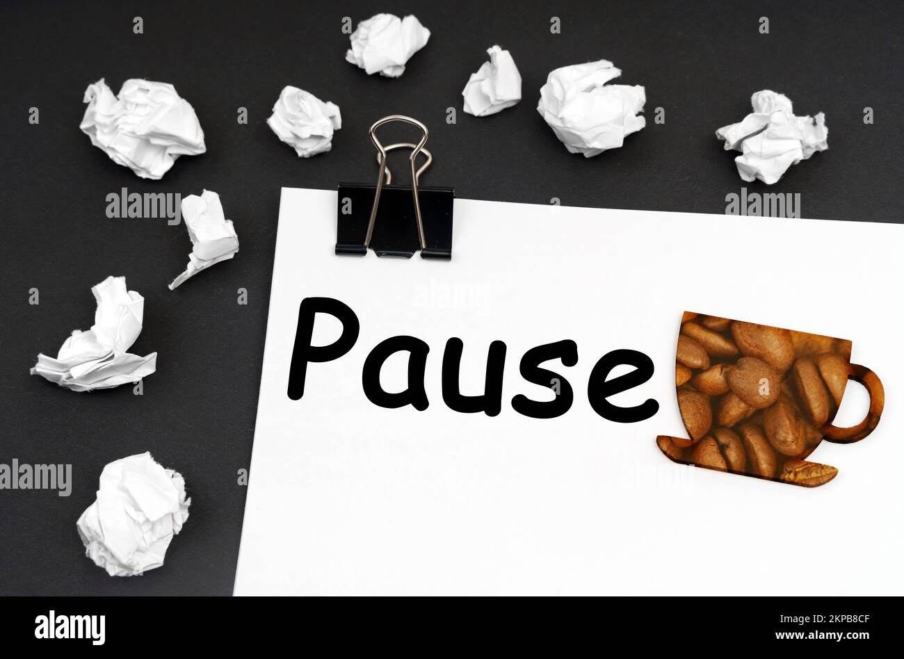 Rest at work. On the black surface is a white sheet with the ...