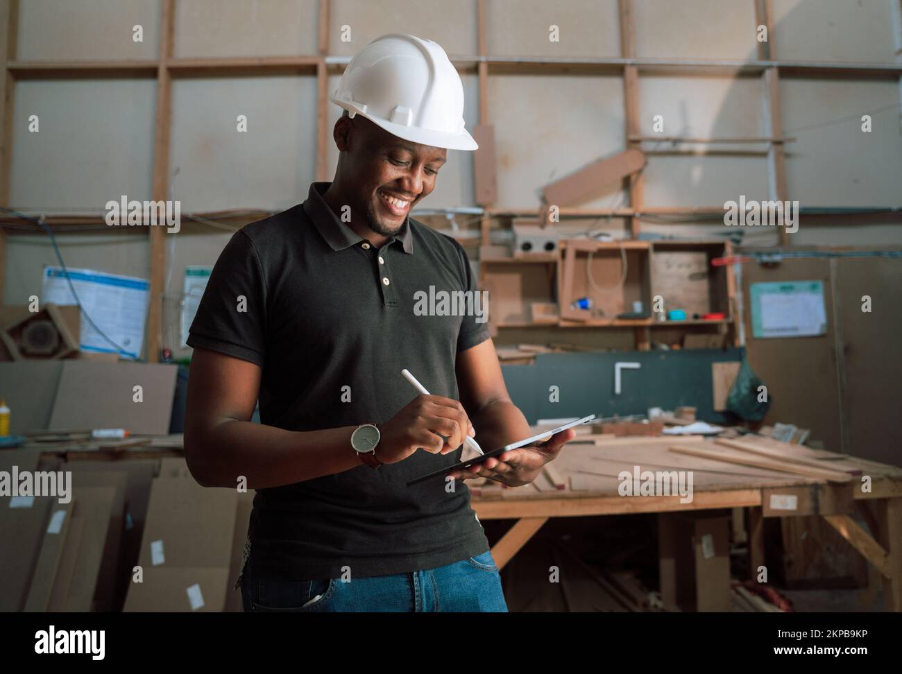 Smiling confident african carpenter hi-res stock photography and images ...