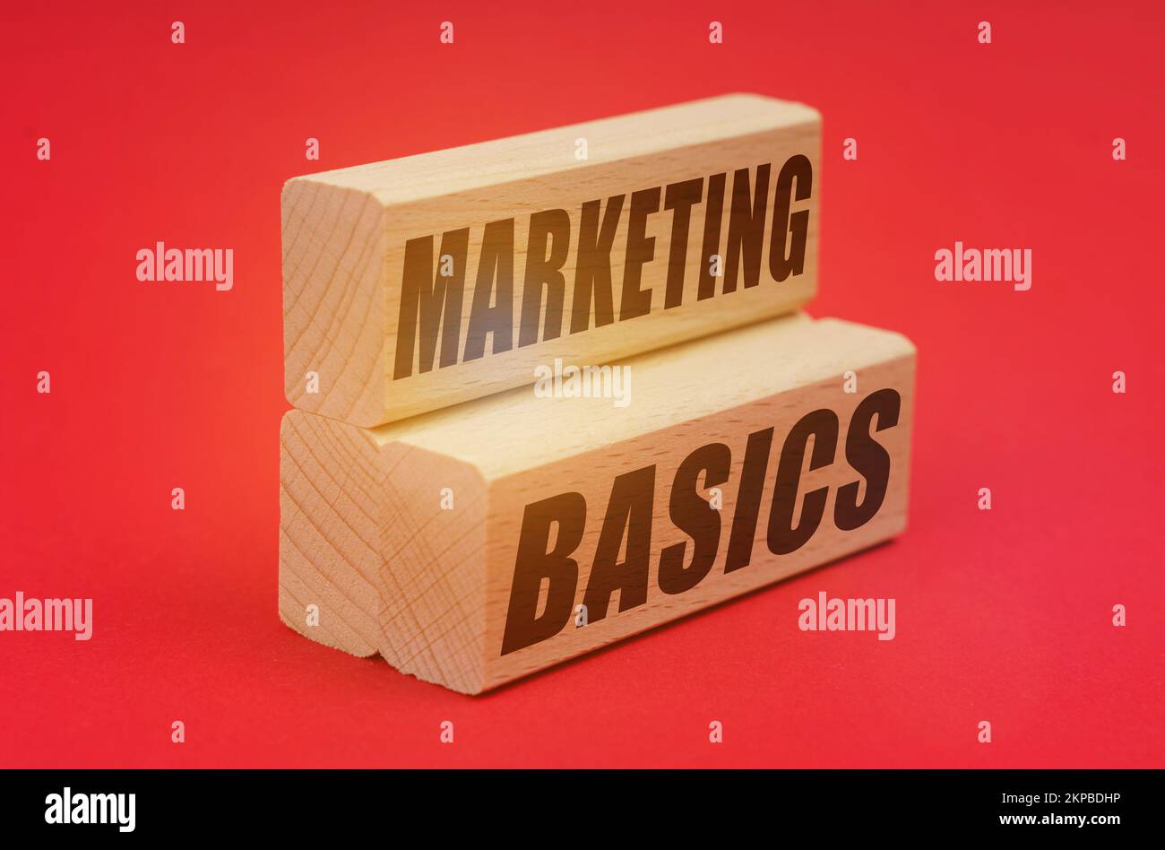 Business and economy concept. On a red background, wooden blocks with ...