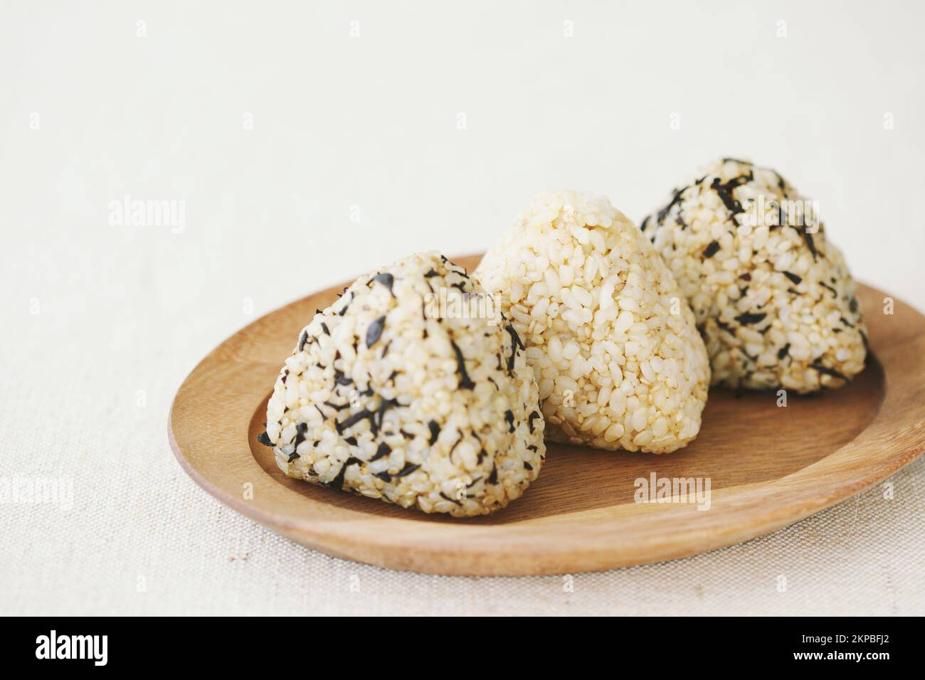 Brown rice and seaweed rice balls Stock Photo - Alamy