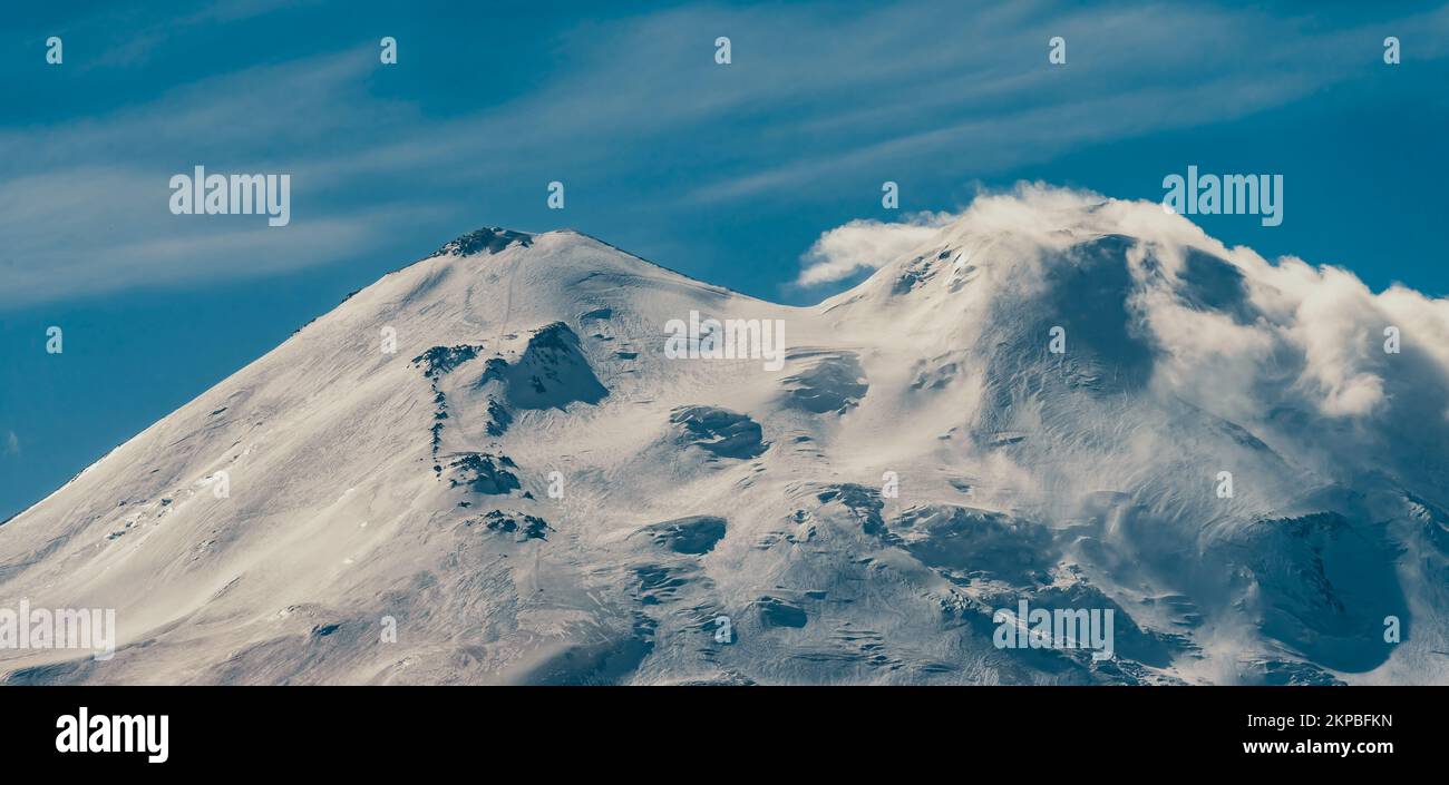 Big mountain Elbrus. Snow covered Greater Caucasus mountains. The two ...