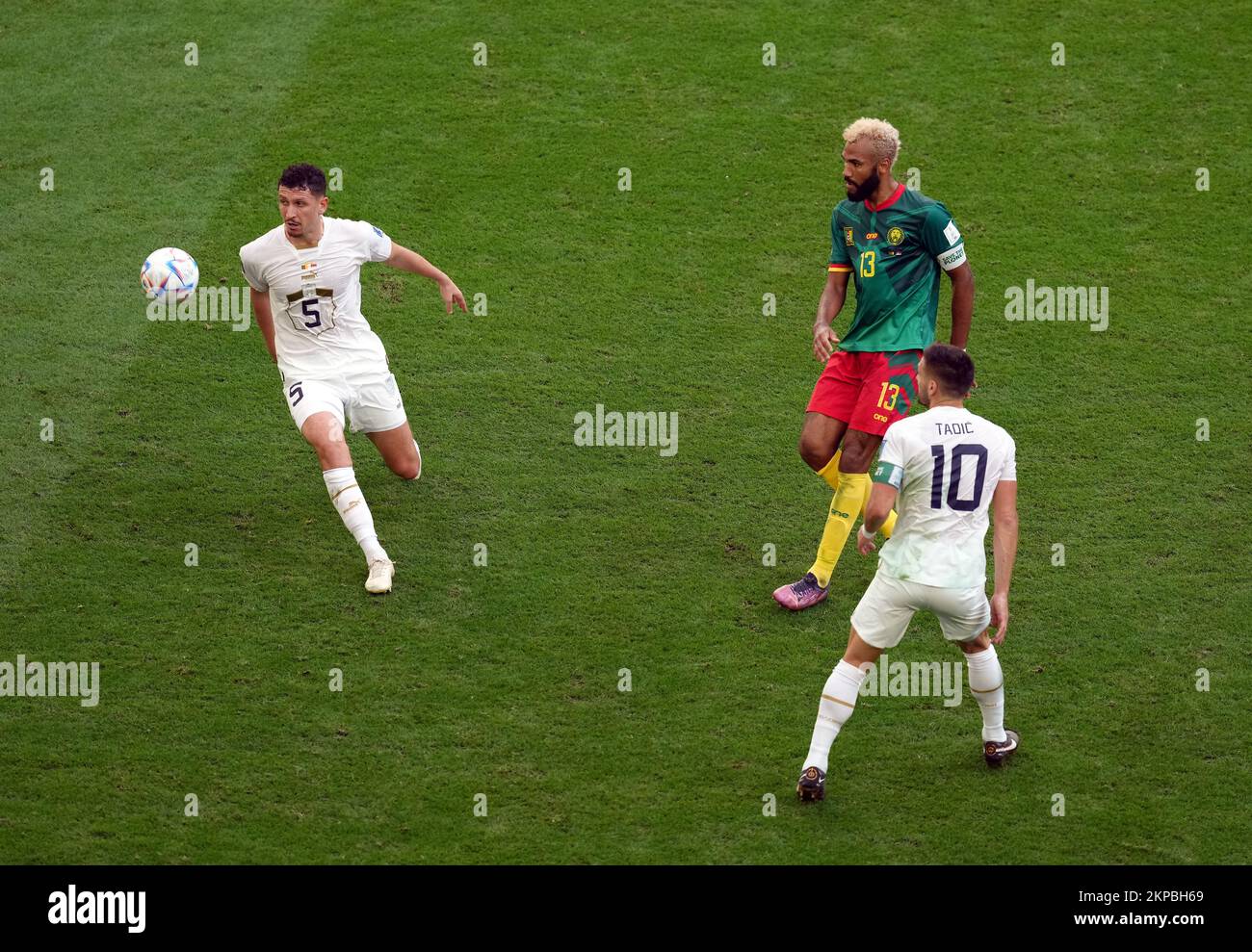 Cameroon's Eric Maxim Choupo-Moting (second right) chips the ball ...