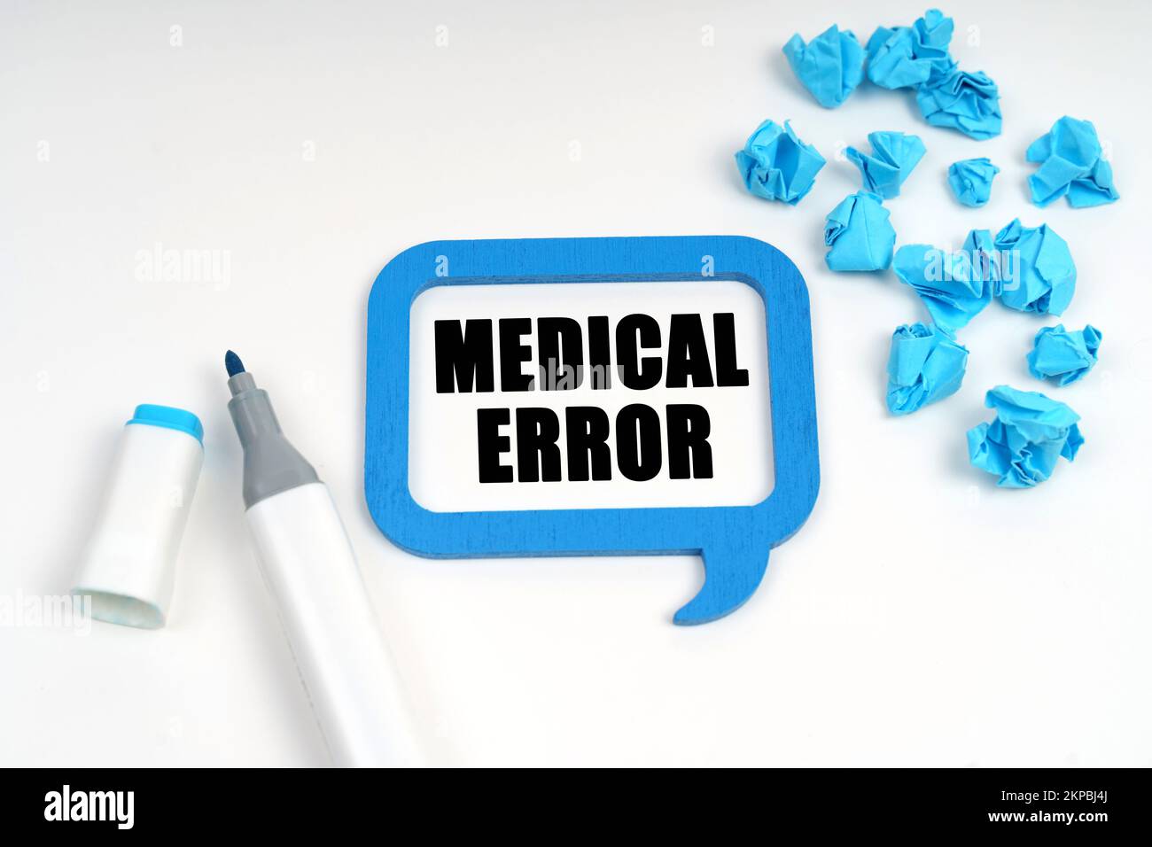 Medicine and health. On a white surface are crumpled blue paper, a ...