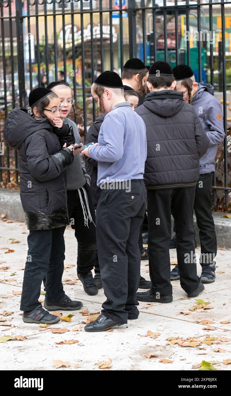 During recess from their yeshiva school. orthodox Jewish boys gather ...