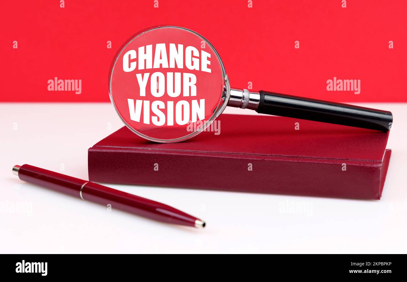 Business and finance concept. On a white and red background, a notebook ...