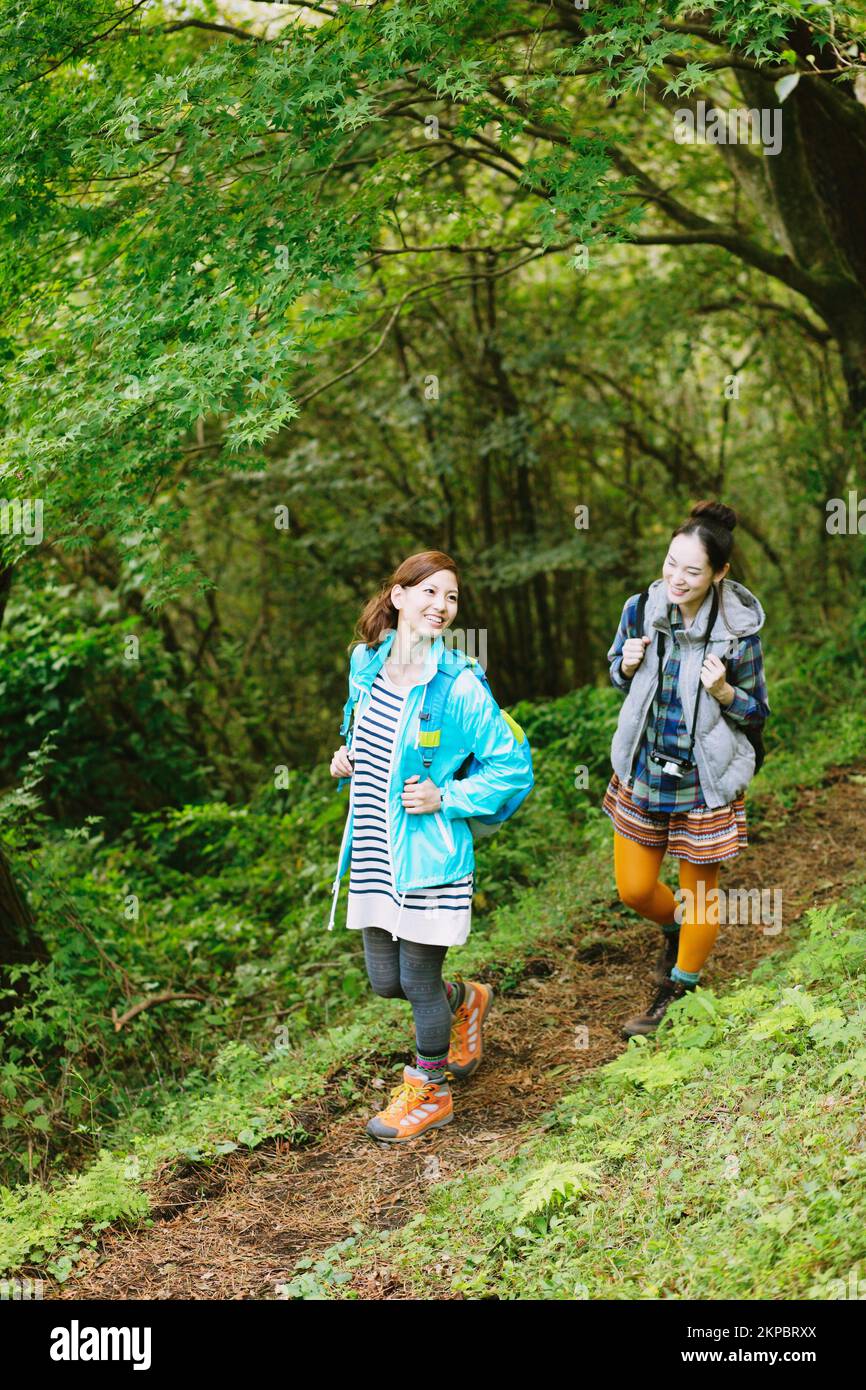 Two young women hiking above the city hi-res stock photography and ...