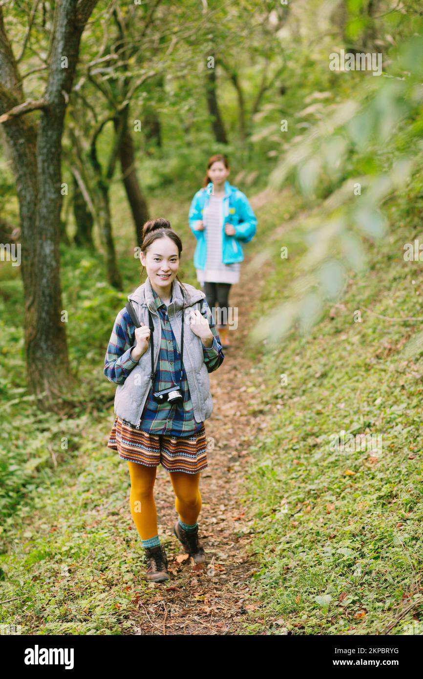 Two young women hiking above the city hi-res stock photography and ...