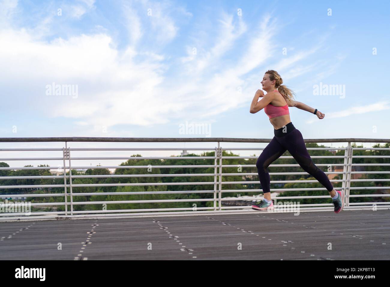horizontal photo of strong woman running in the city, copy space ...
