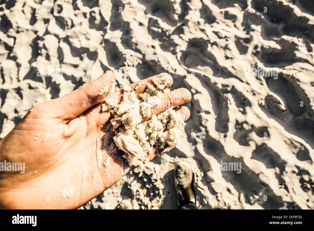 Man hands holding spilling sand hi-res stock photography and images - Alamy